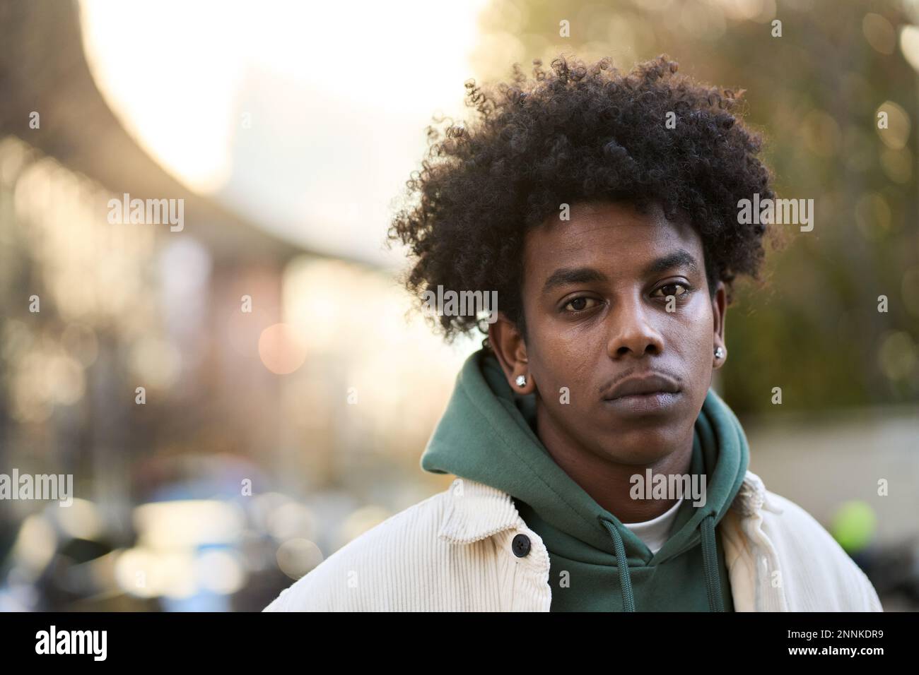 Cool confident young hipster gen z African American teen outdoors ...