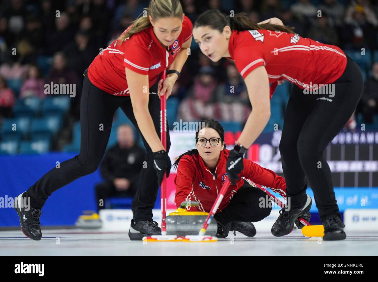 Team Canada skip Kerri Einarson delivers a rock as lead Briane Harris ...