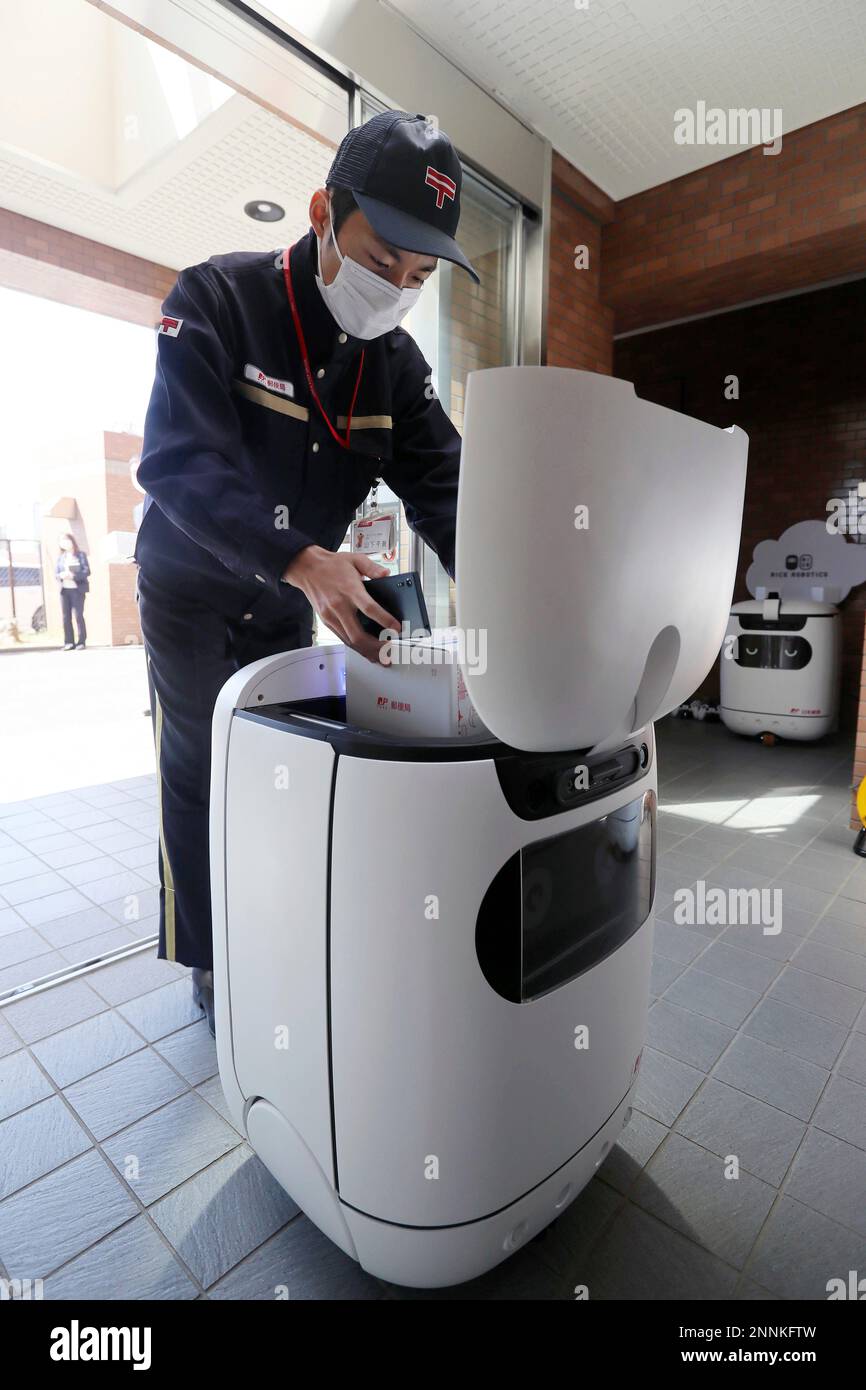 Japan Post Group (JP) conducts a demonstration of a robotic delivery ...