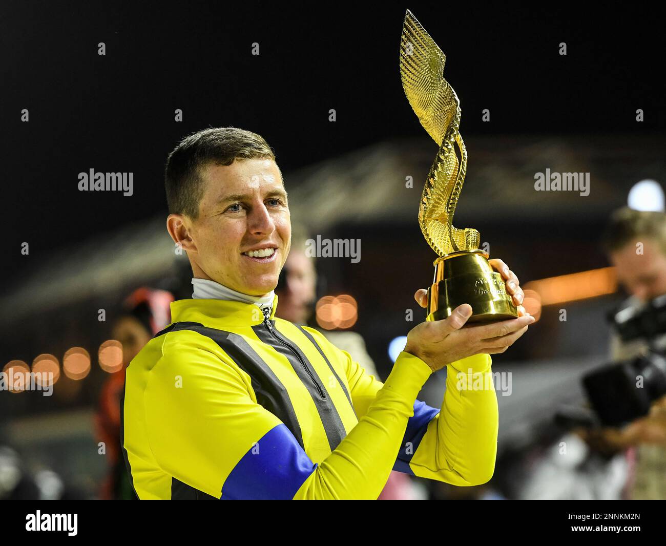 Silver Sonic's jockey Damian Lane holds the trophy after winning the G3 ...