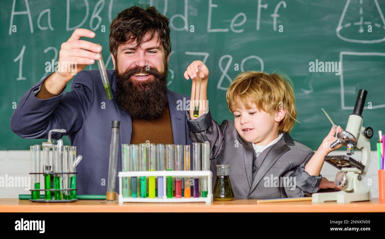 Back to school. Chemistry experiment. Teacher child test tubes. Kid ...