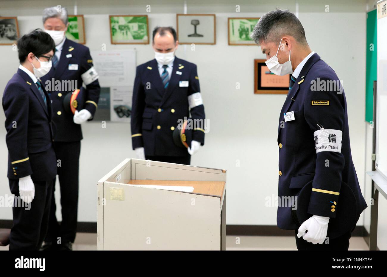 Staffs of Tokyo Metro pray silently for victims who were killed in the ...