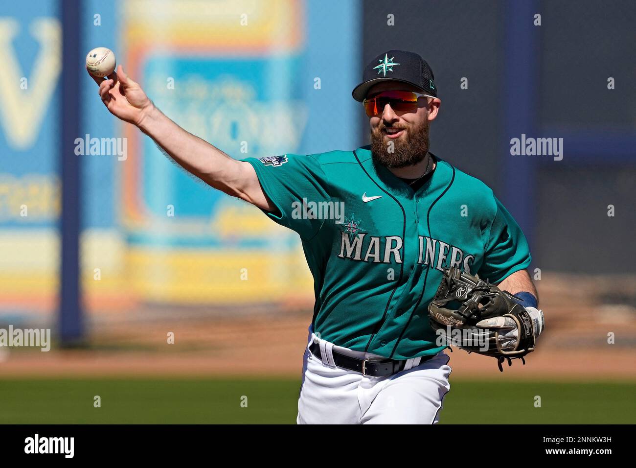 Seattle Mariners shortstop Mason McCoy throws to first for the out on ...
