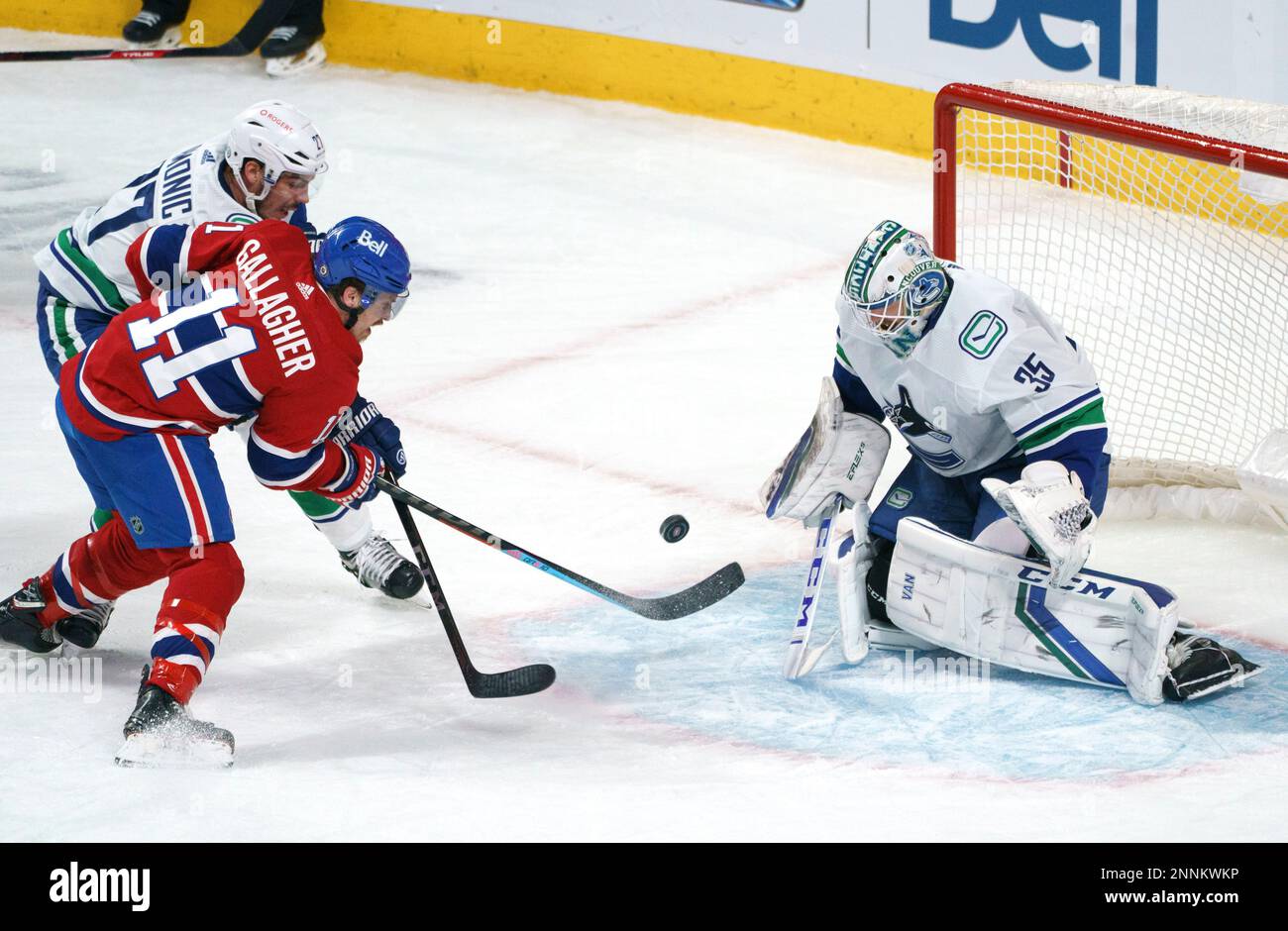 Vancouver Canucks goaltender Thatcher Demko, right, stops Montreal ...