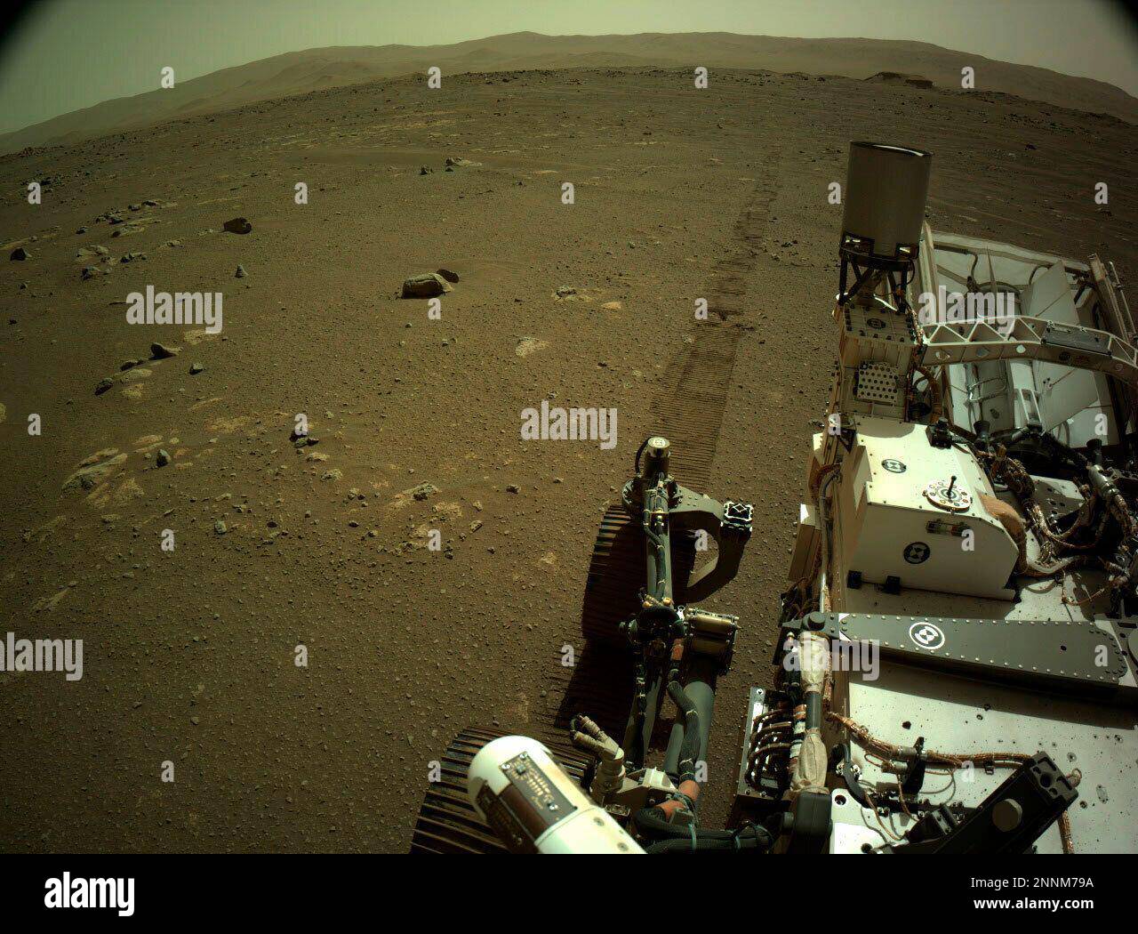 This Mar. 7, 2021 photo provided by NASA shows tire tracks left by the ...