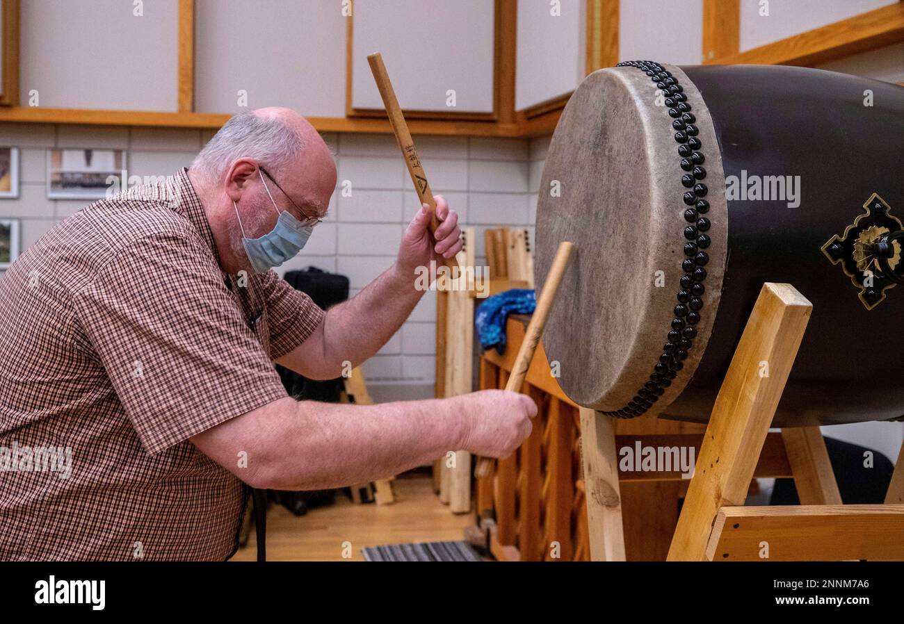 Wartburg College professor Craig Hancock plays a beat on one of five ...