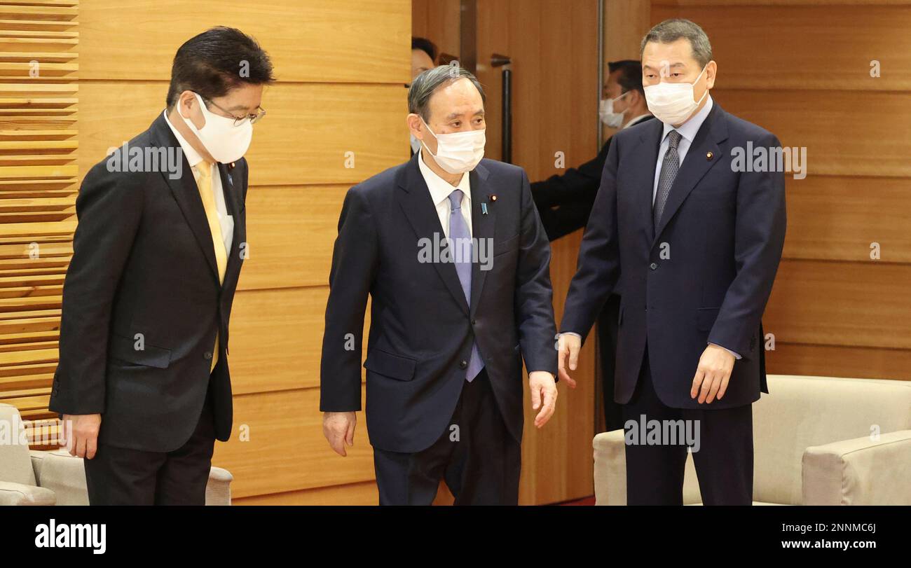 Japan's Prime Minister Yoshihide Suga (C) attends a cabinet meeting at ...