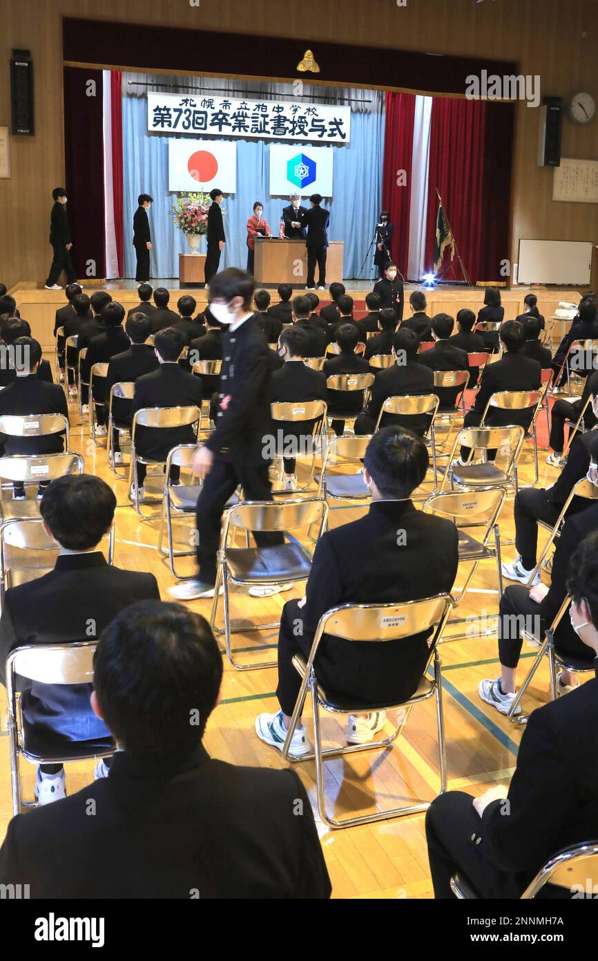 Junior high school students wearing face masks participate in the ...