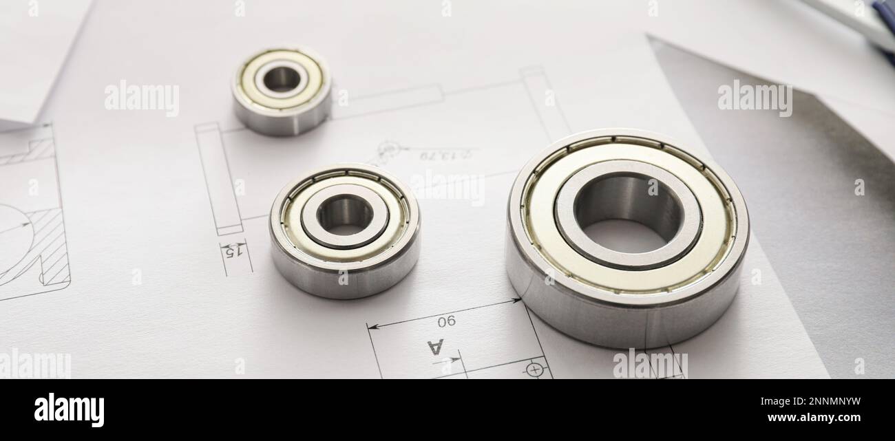 Bearings and drawings on table of engineer, closeup Stock Photo - Alamy