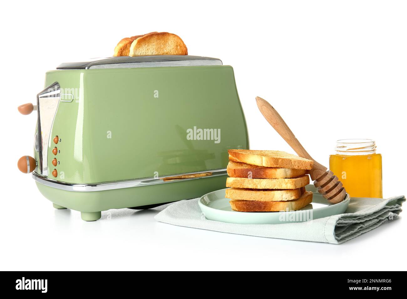 Modern toaster with bread slices, jar of honey and tasty toasts isolated on white background ...