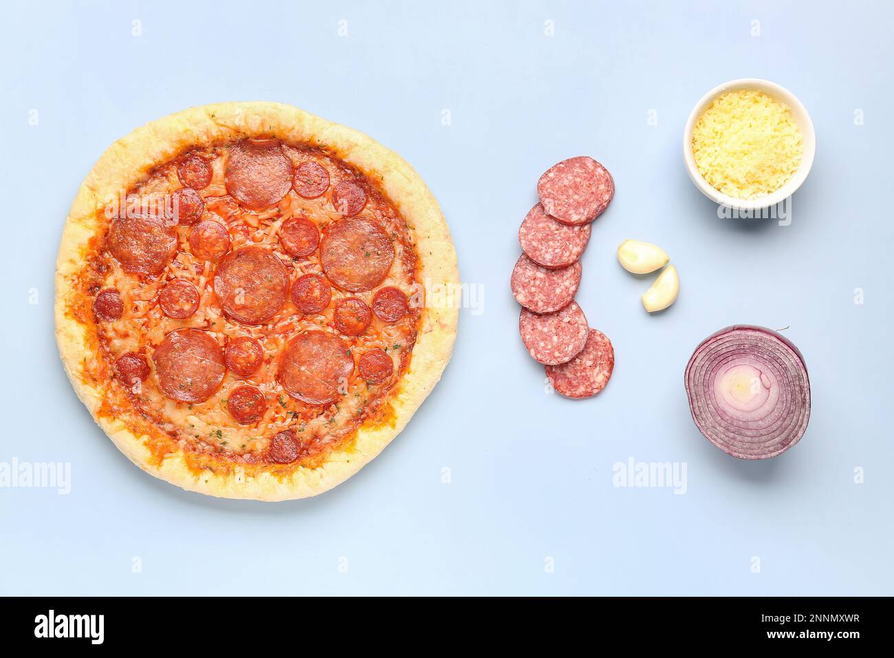 Delicious pepperoni pizza and ingredients on blue background Stock ...