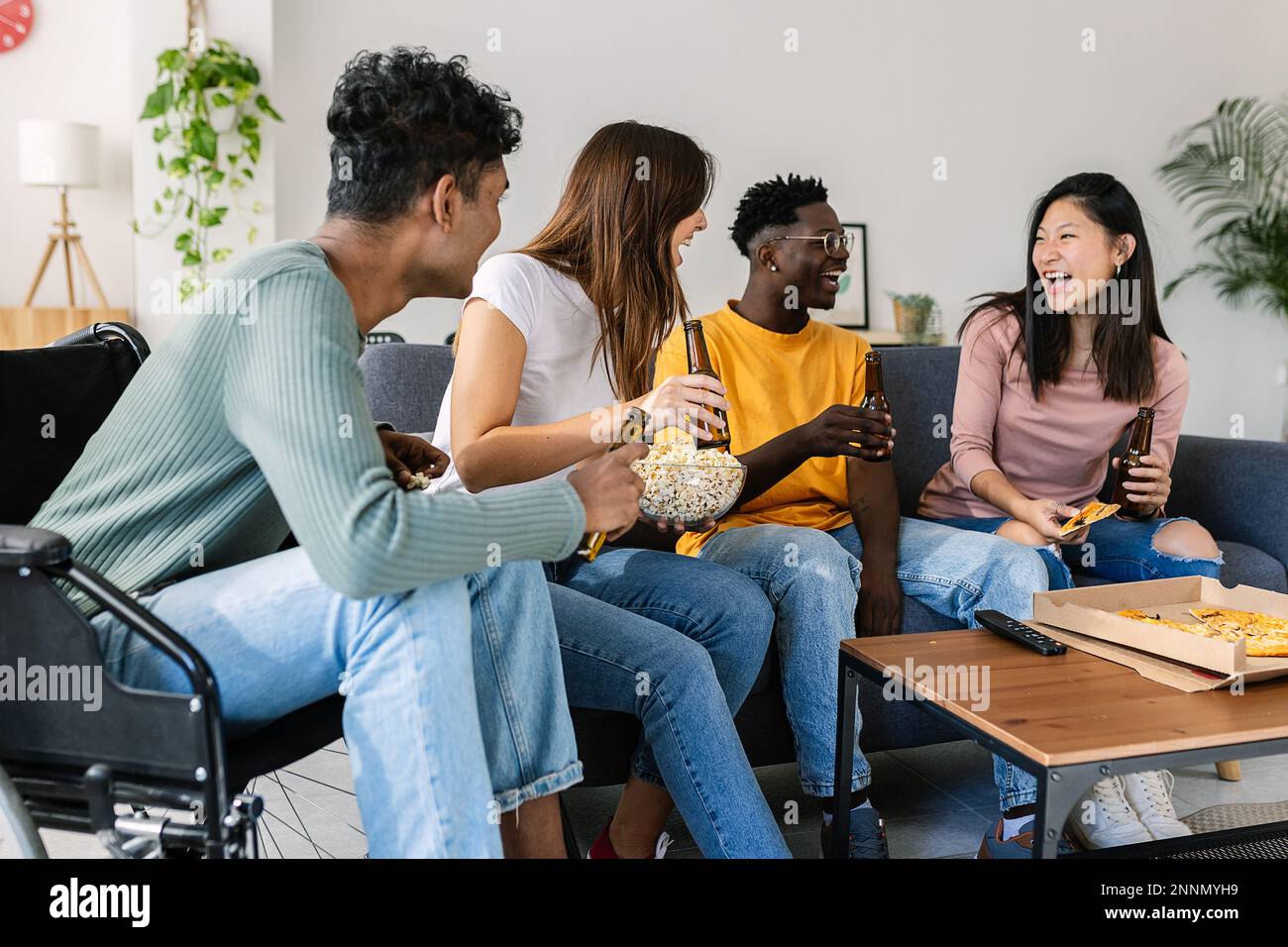 Group of multiracial friends social gathering at home Stock Photo - Alamy