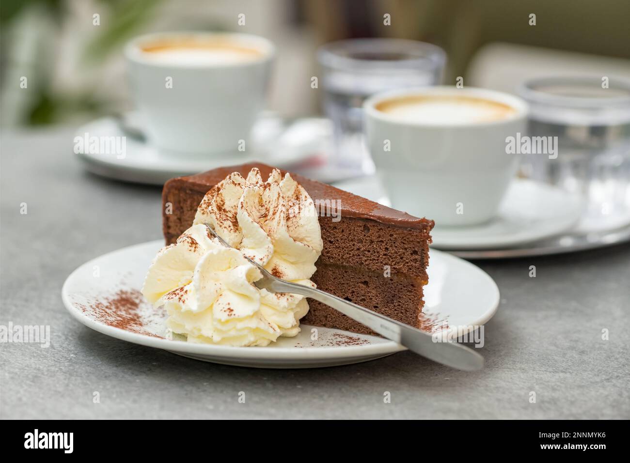 Slice of Sacher Torte cake on plate at Cafe in Vienna, Austria Stock ...