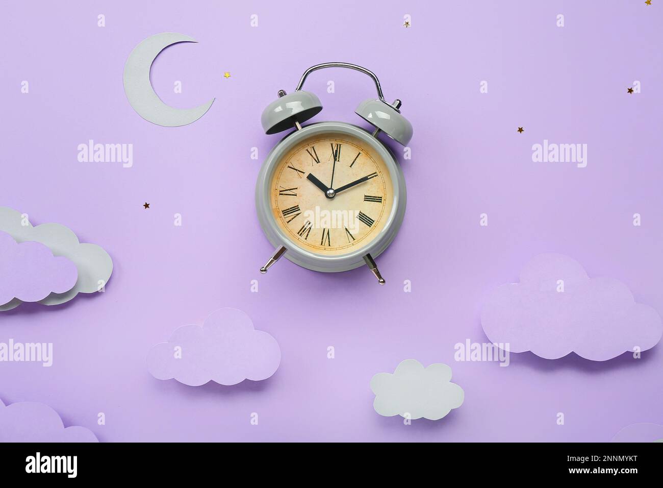 Composition with alarm clock and paper decor on color background. World ...