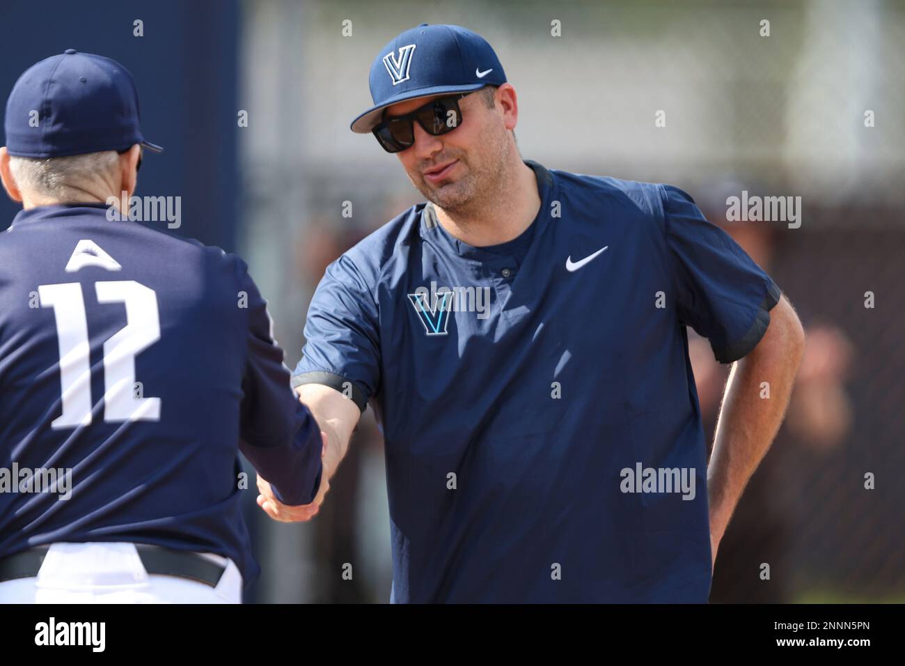 Villanova head coach Kevin Mulvey shakes hands with North Florida head ...