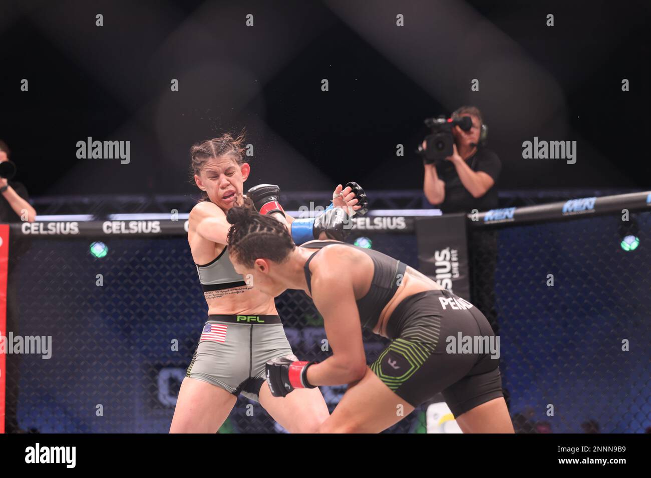 ORLANDO, FL - February 24 Helen Peralta lands a shot on Lisa Mauldin ...