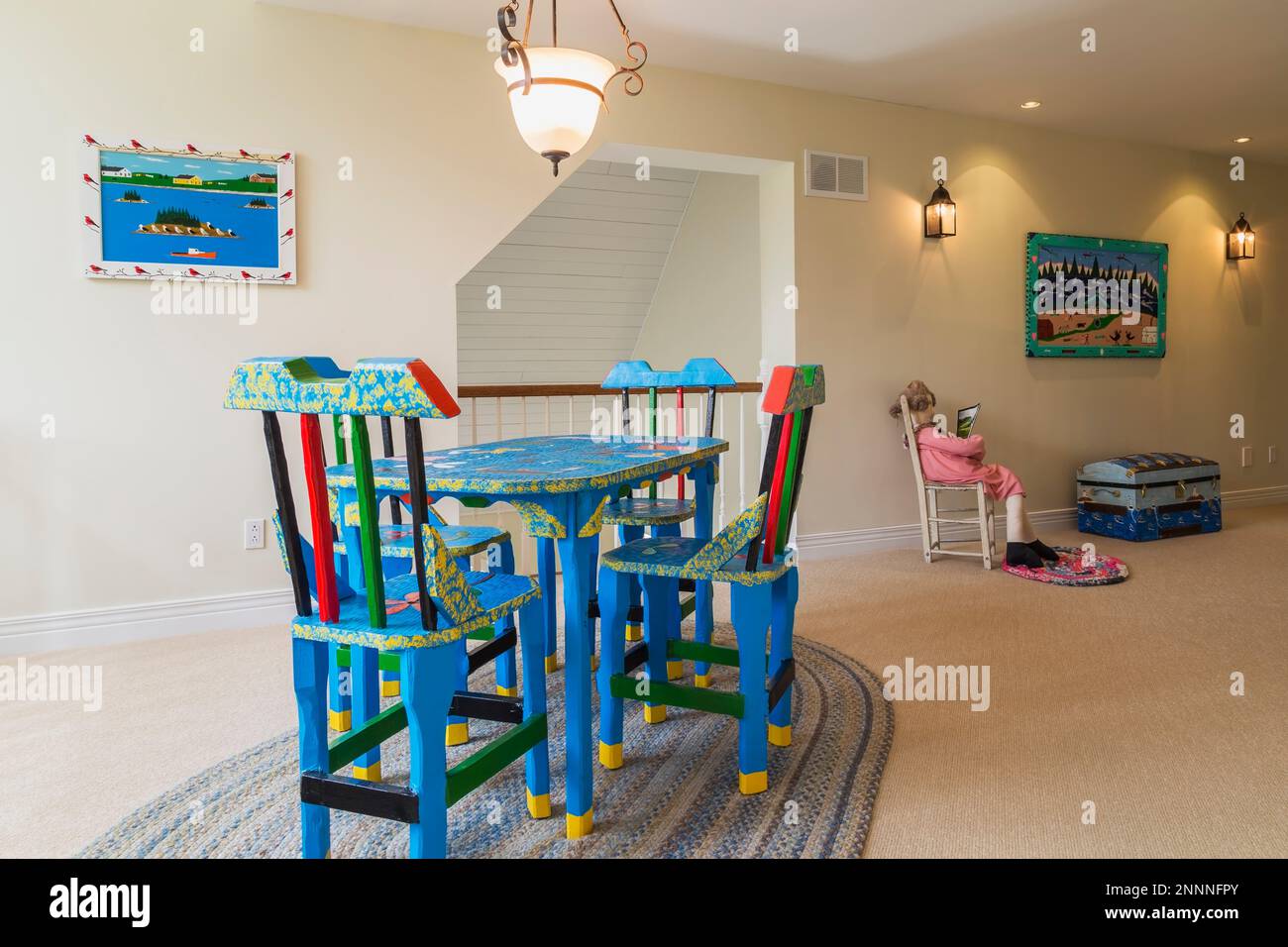 Blue and yellow painted wooden folk art table and high back chairs on ...
