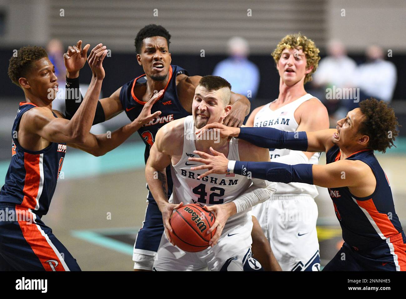 LAS VEGAS, NV - MARCH 08: BYU center Richard Harward (42) is surrounded ...