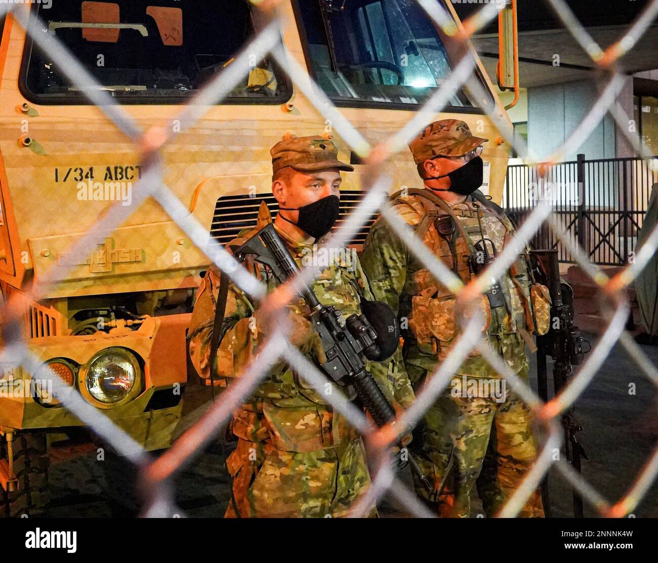 National Guard troops watch the pedestrian entrance Monday, March 8 ...