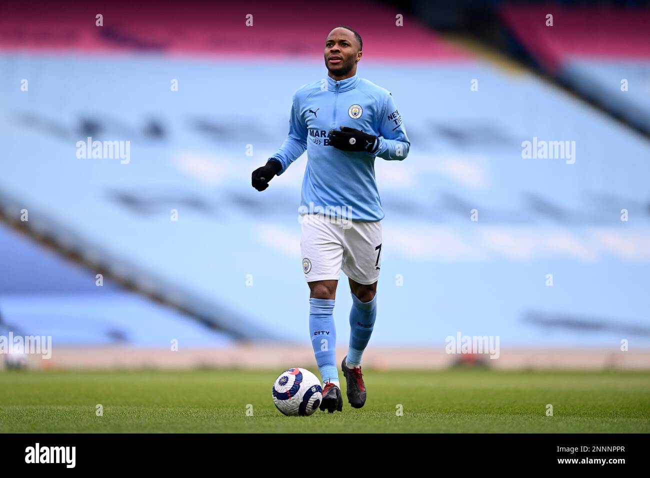 Manchester City's Raheem Sterling runs during warmup before the English ...