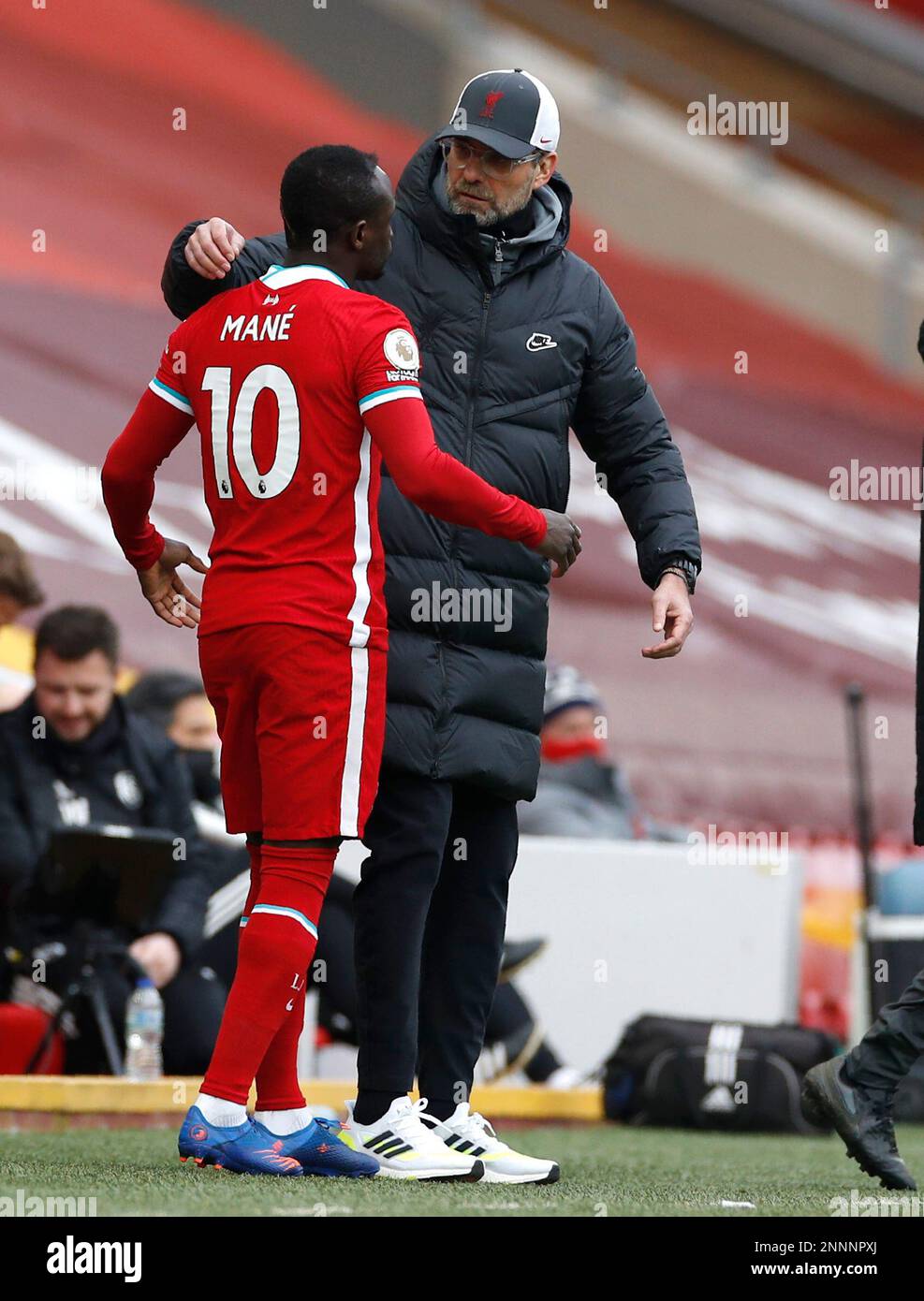 Liverpool Manager Juergen Klopp Hugs His Player Sadio Mane During The