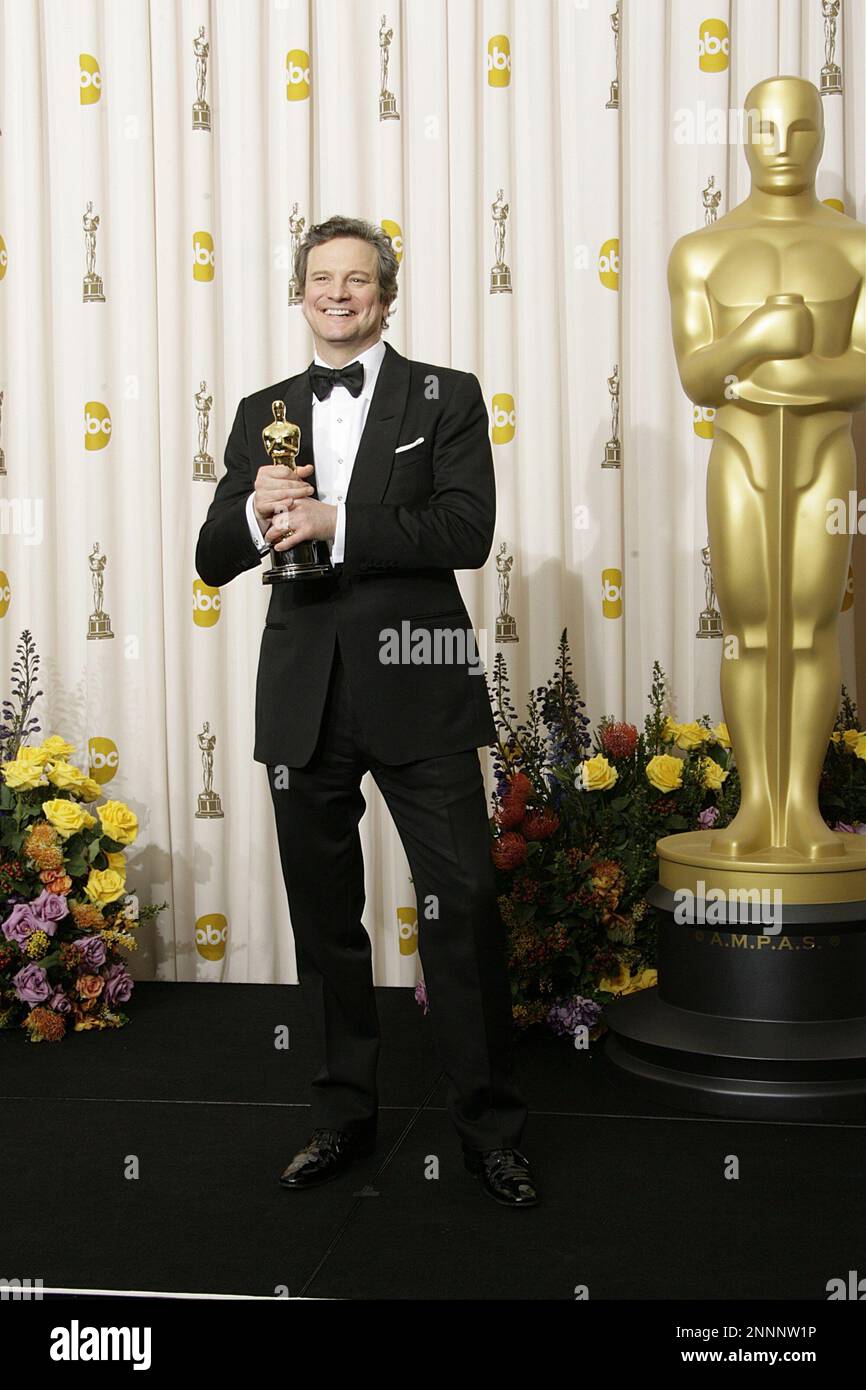 Actor Colin Firth holds the award for Best Actor in a Motion Picture ...