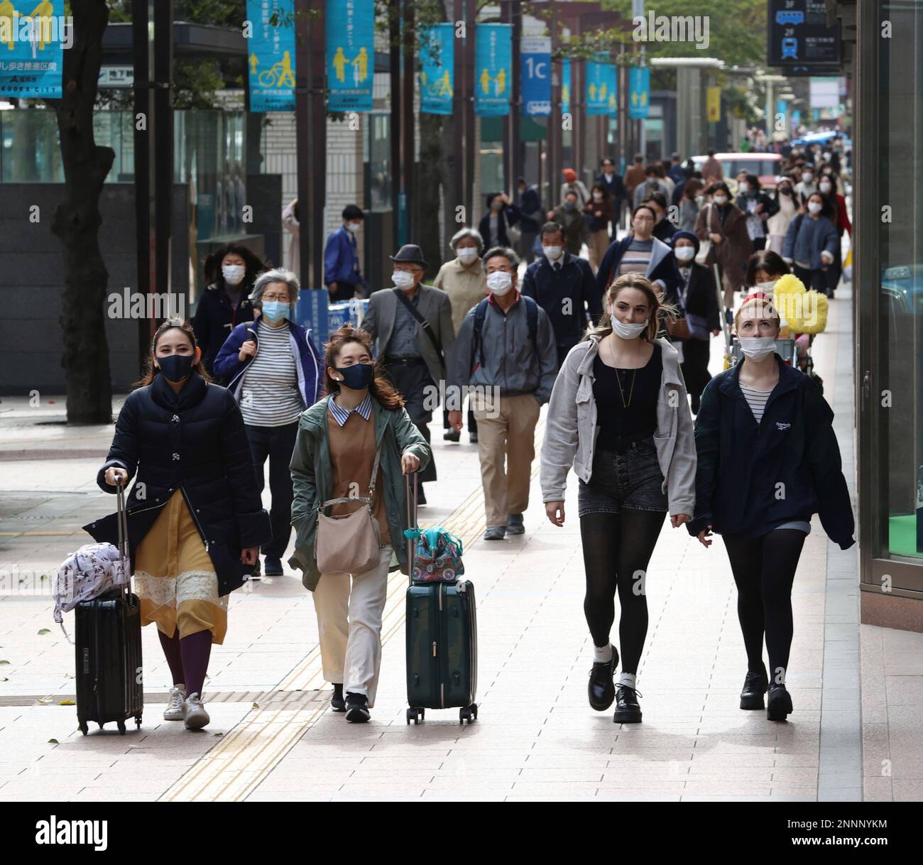 People wearing masks are seen at Tenjin area in Fukuoka City, Fukuoka ...