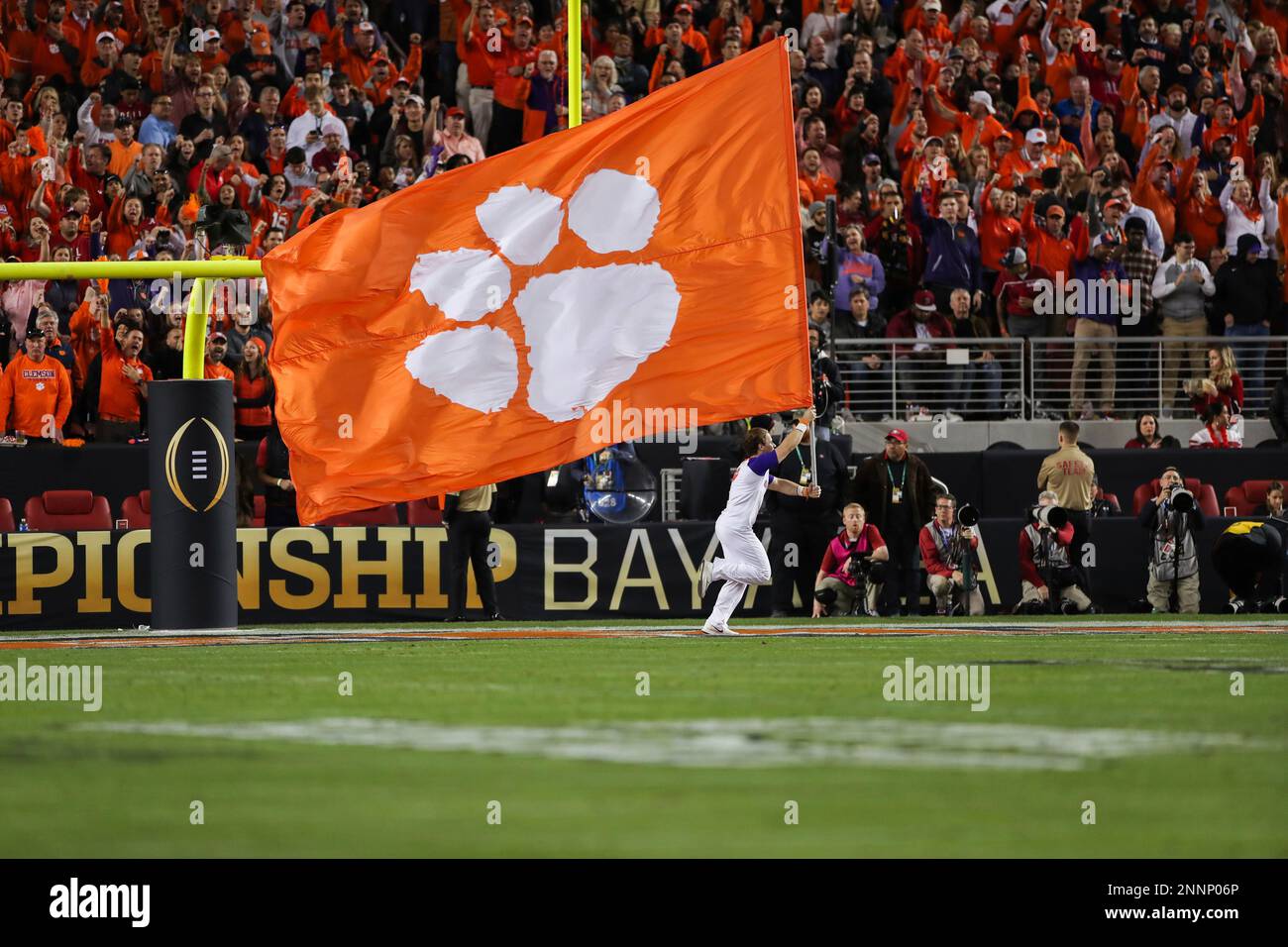 The Clemson Tigers flag is run across the field during an NCAA football ...