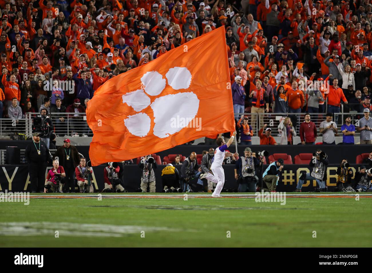 The Clemson Tigers flag is run across the field during an NCAA football ...