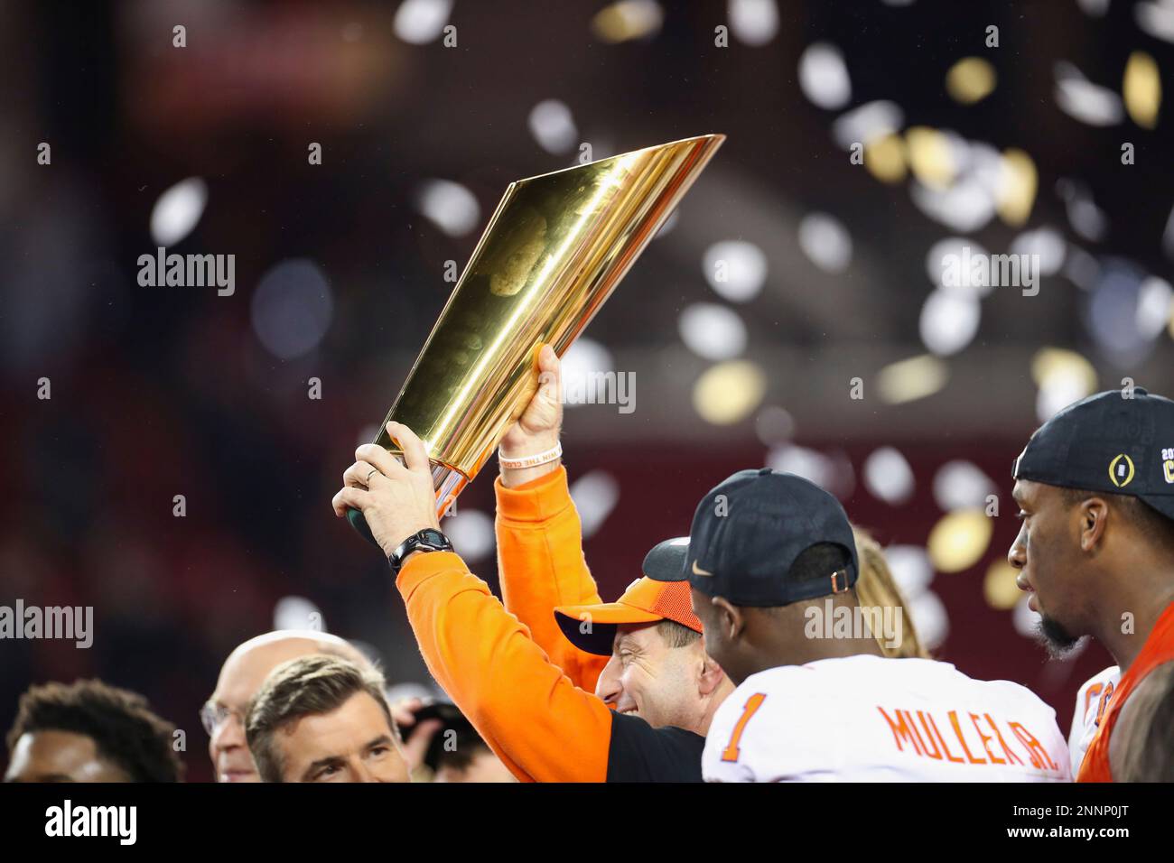 Clemson Tigers head coach Dabo Swinney holds up the National ...