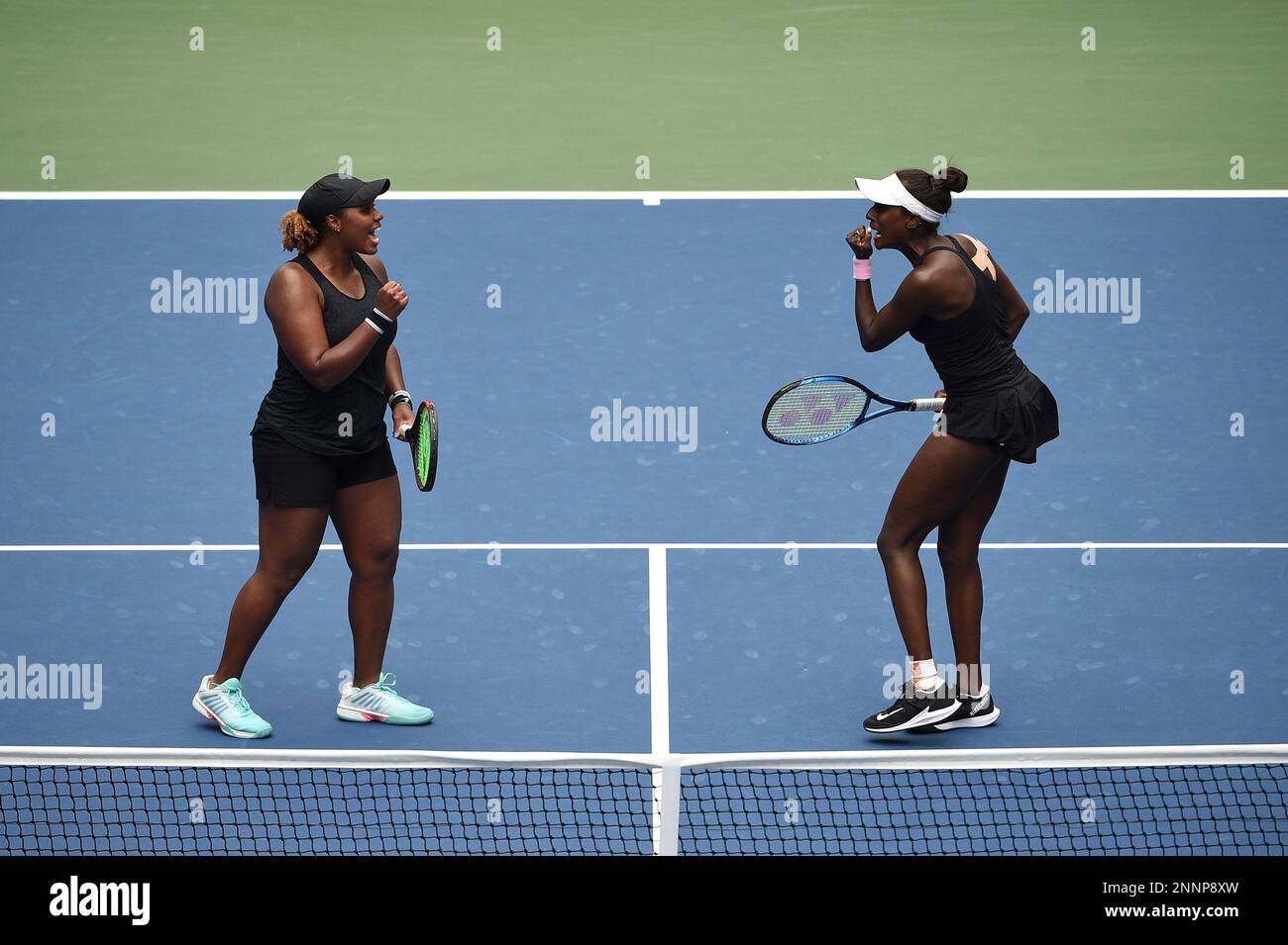 Asia Muhammad and Taylor Townsend in action against Nicole Melichar and ...