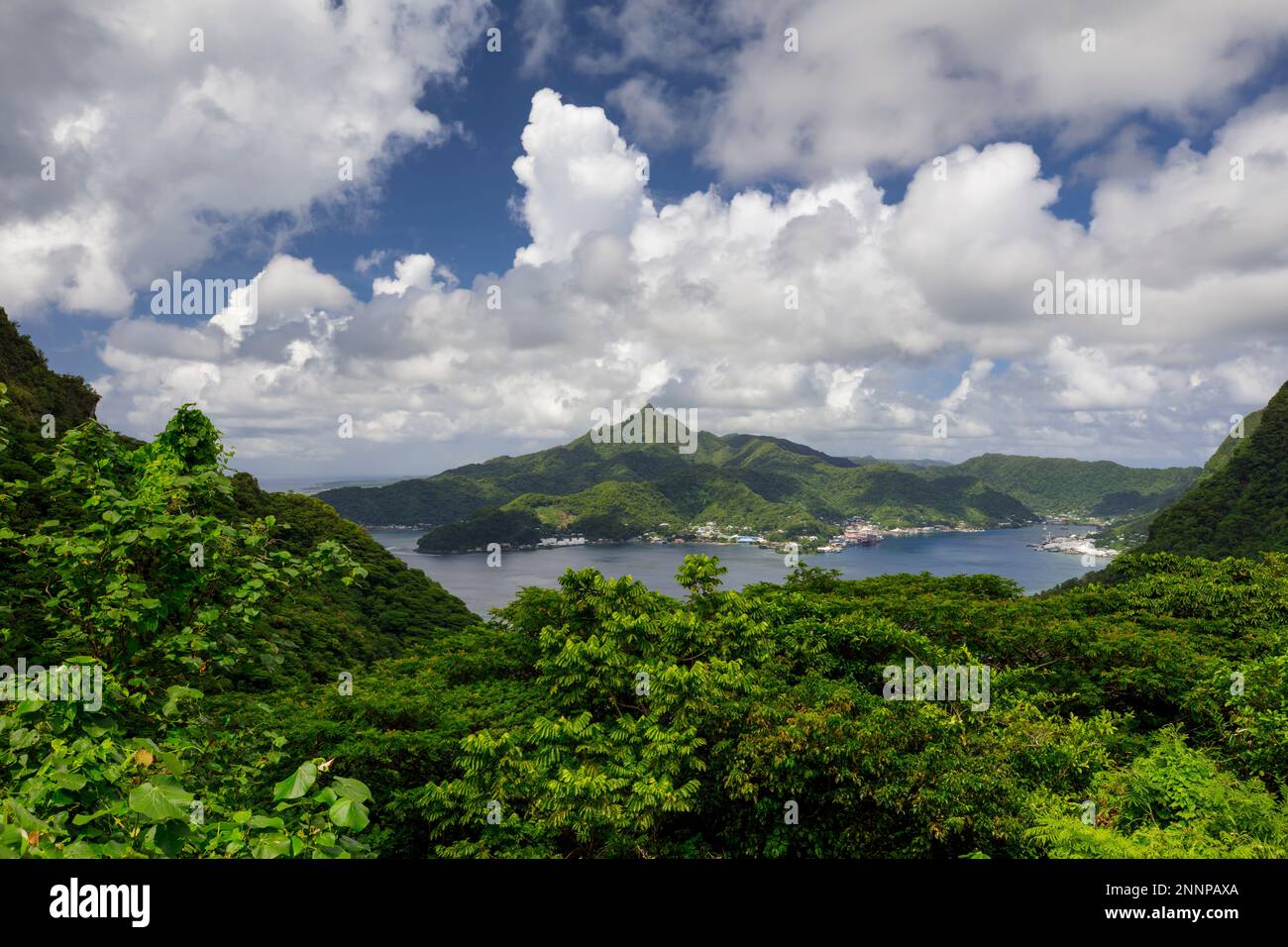 An aerial view of Pago Pago Harbor and Mt. Matafau on a bright sunny ...