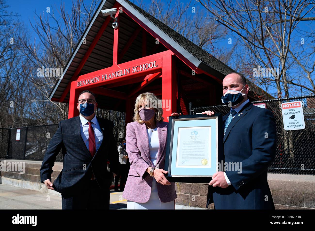 From left, Education Secretary Miguel Cardona, first lady Jill Biden ...