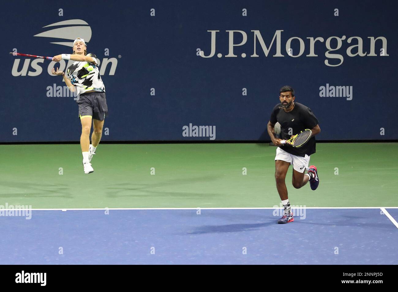 Rohan Bopanna and Denis Shapovalov in action against Ernesto Escobedo ...