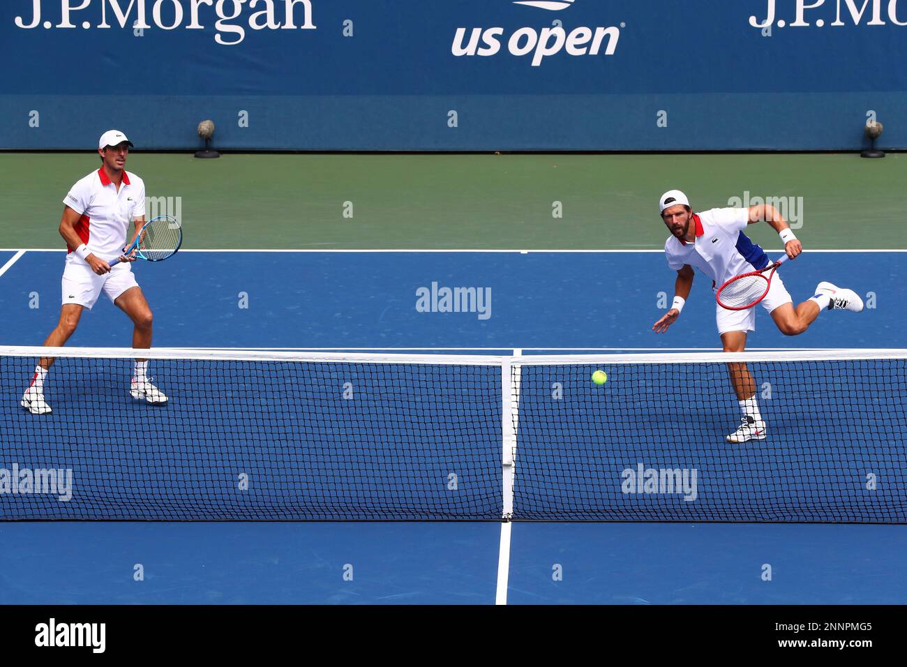 Jurgen Melzer and Edouard Roger-Vasselin in action against Juan ...