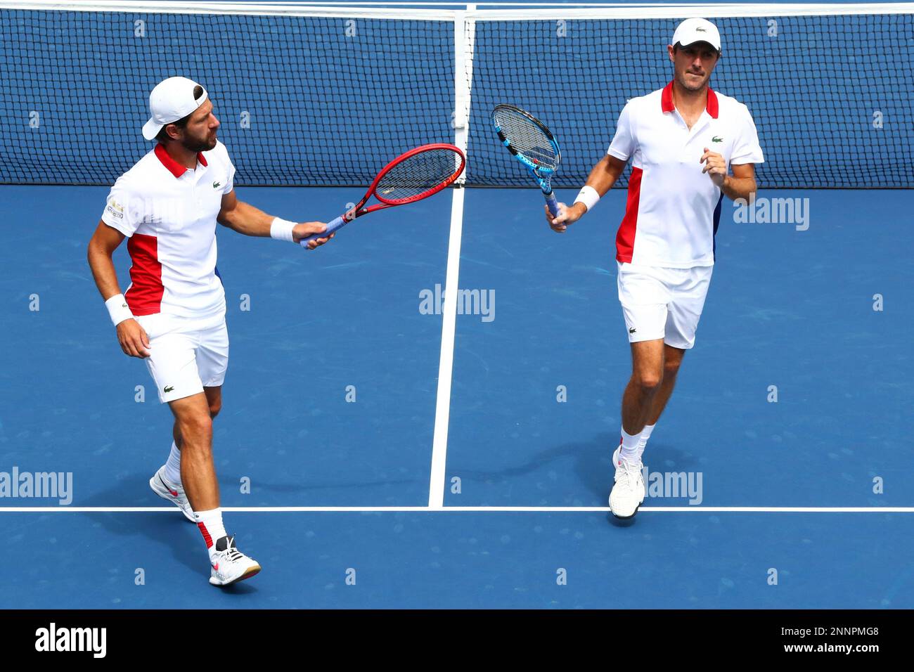 Jurgen Melzer and Edouard Roger-Vasselin in action against Juan ...