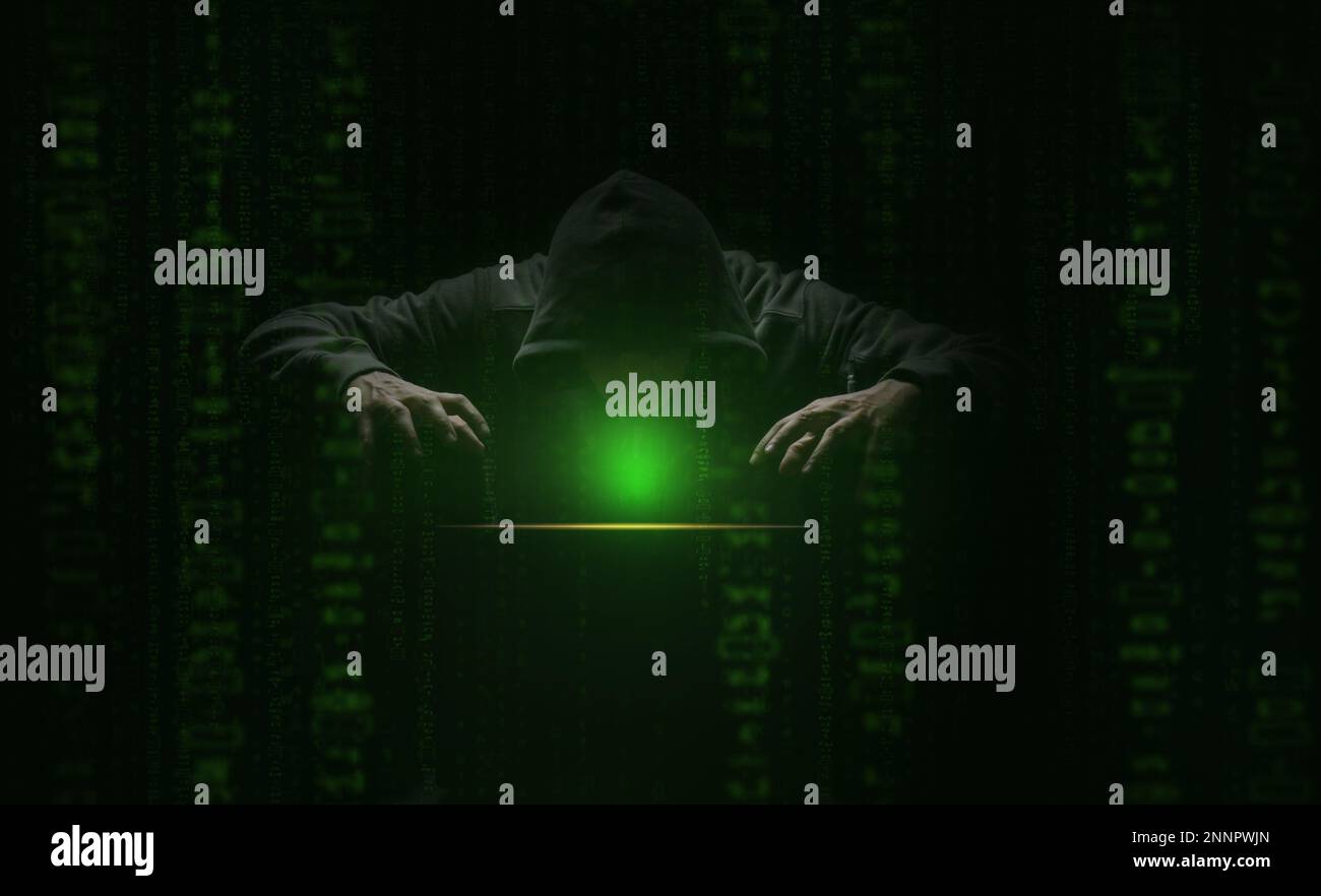 Hacker Over A Screen With Green Binary Code Crime And Information Theft And Computers Stock 6978
