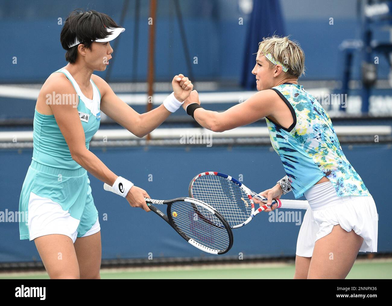 Bethanie Mattek-Sands and Shuai Zhang in action against Asia Muhammad ...