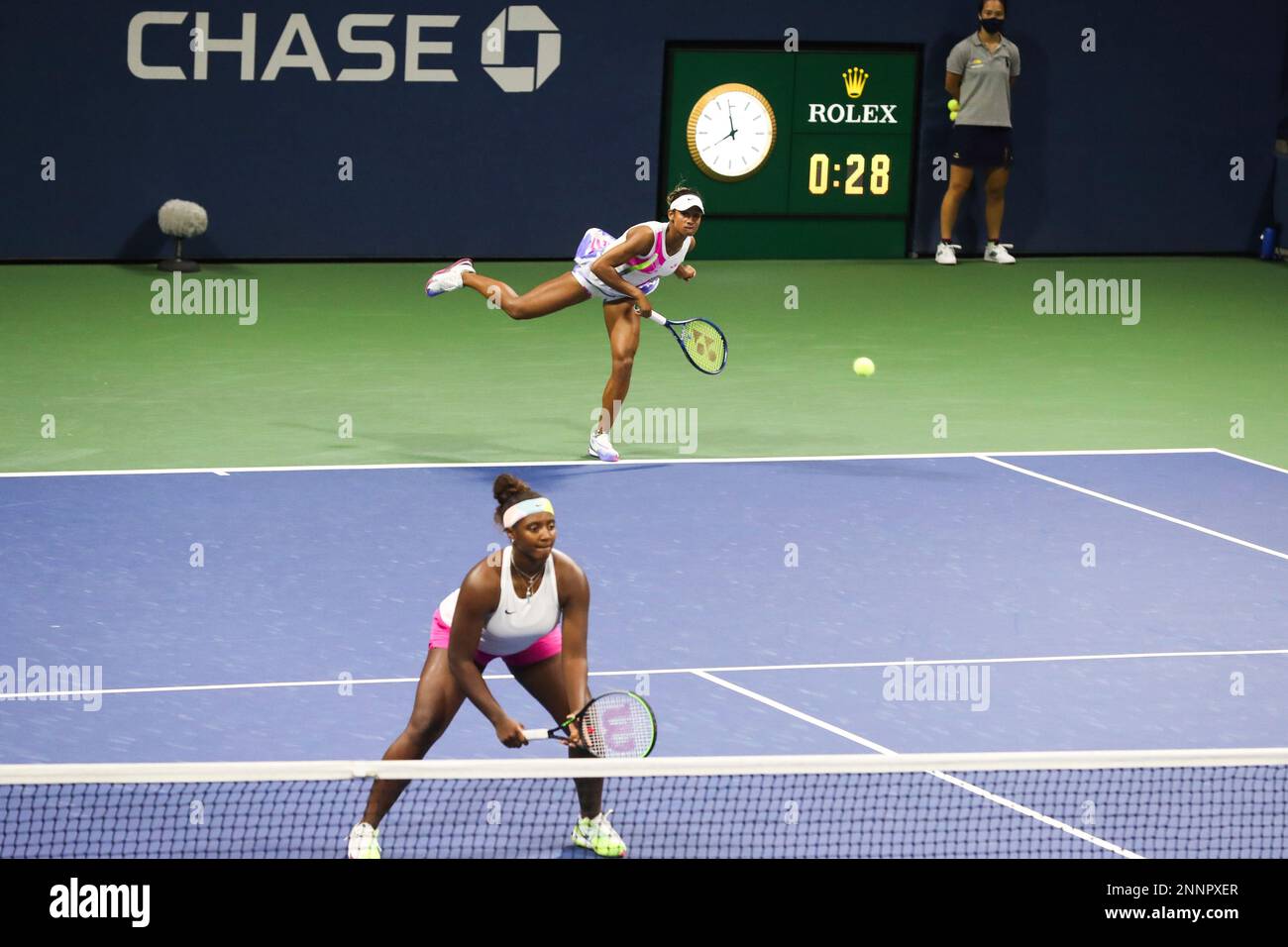 Hailey Baptiste and Whitney Osuigwe in action against Cori Gauff and Catherine McNally during a ...