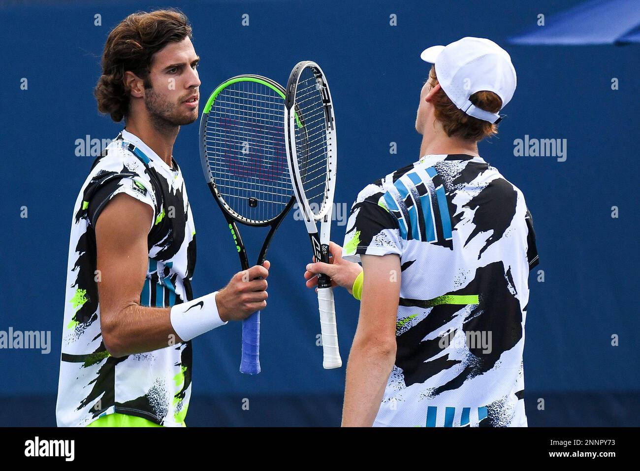 Karen Khachanov bumps rackets with Jannik Sinner after defeating Sinner ...