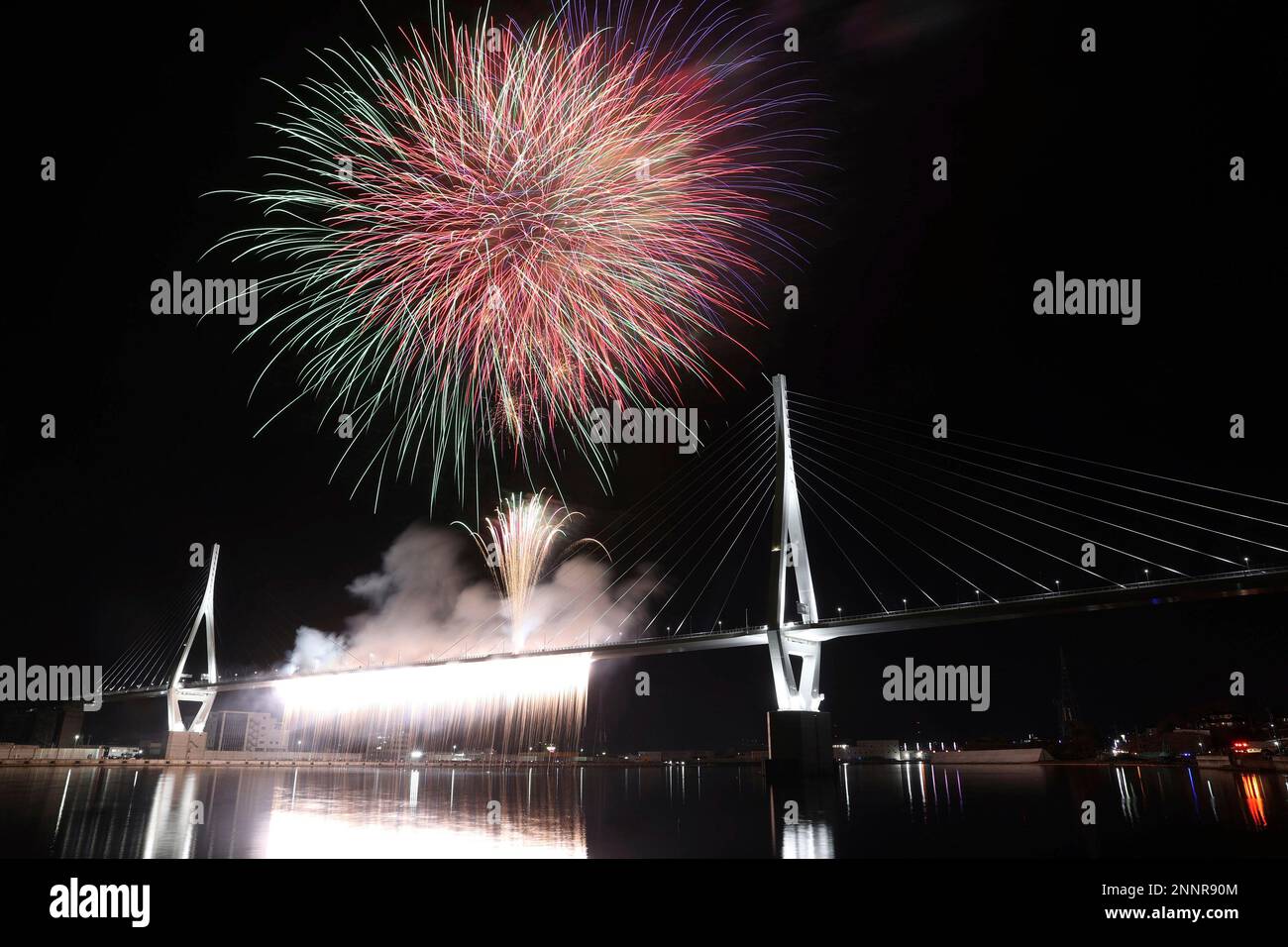 Fire works are seen above Kesennuma Bay Crossing Bridge in Kesennuma ...
