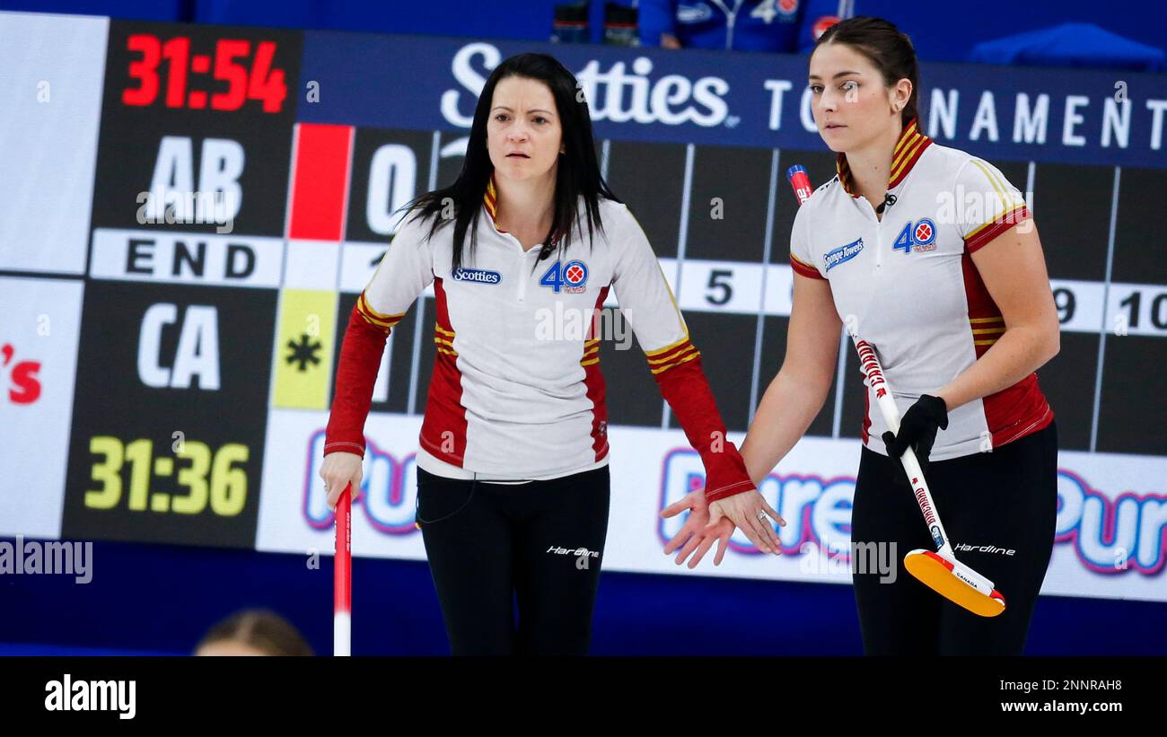 Team Canada skip Kerri Einarson, left, taps hands with second Shannon ...