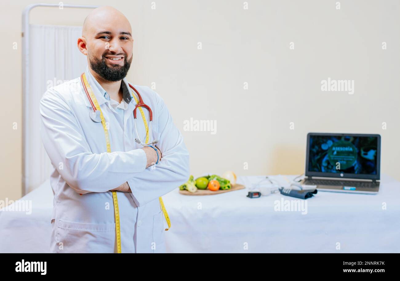 Portrait of smiling male nutritionist at his workplace. Smiling ...