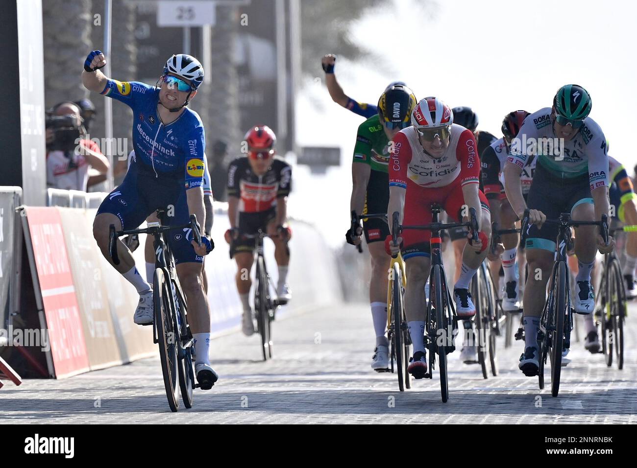 Sam Bennet celebrates as he crosses the finish line to win the sixth ...