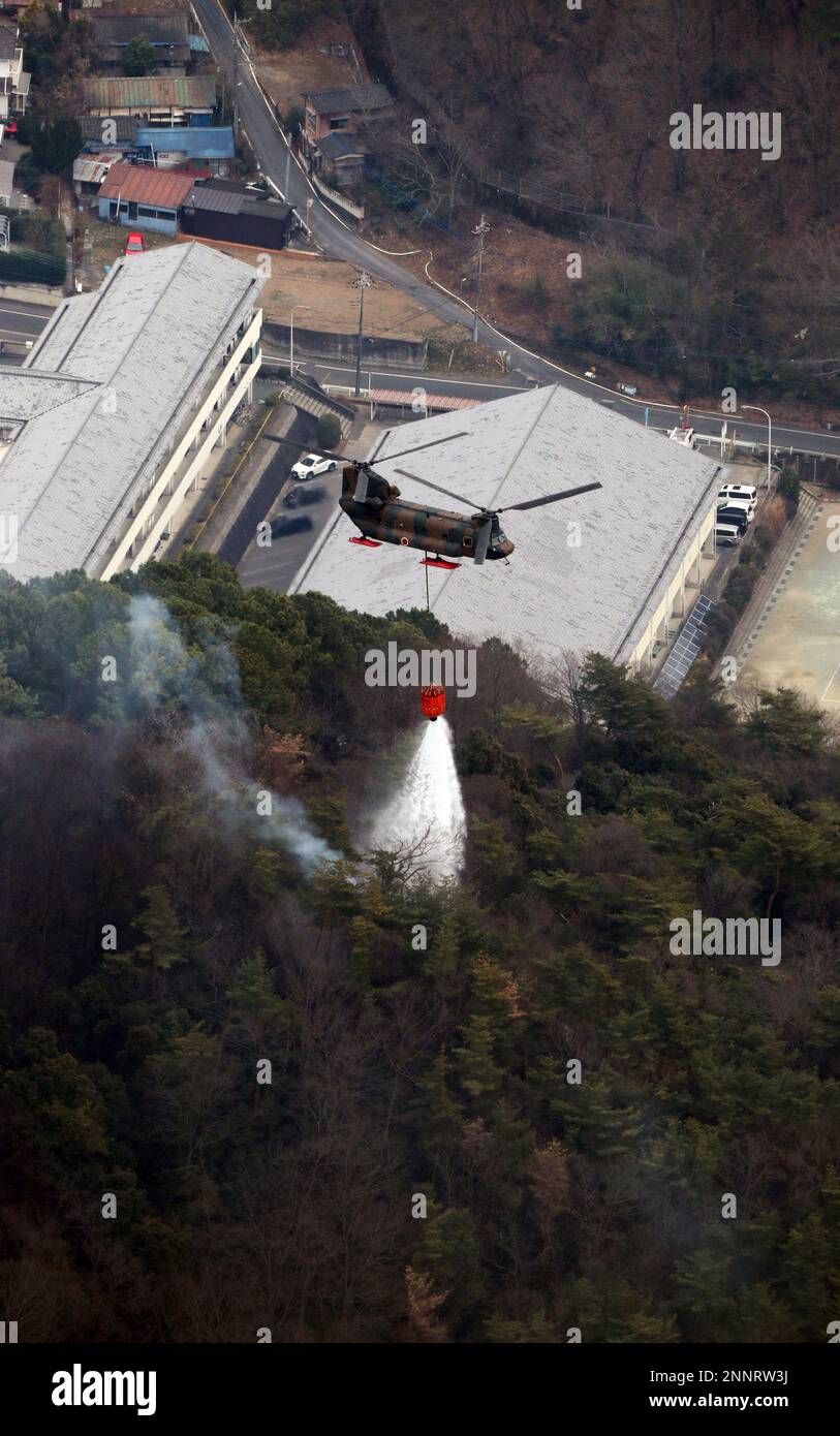 An aerial photo shows a forest fire that continues to spread near a ...
