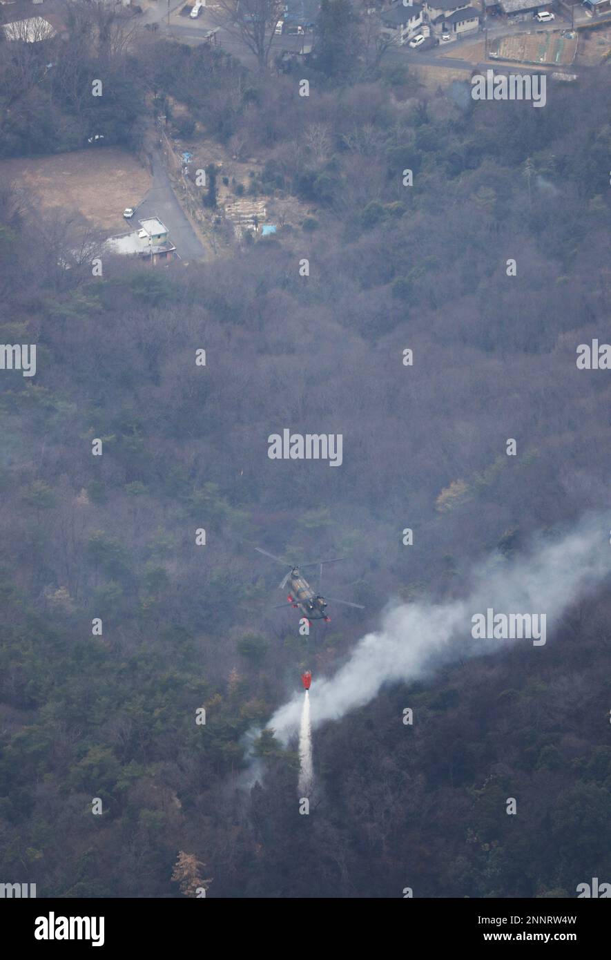 An aerial photo shows a forest fire that continues to spread near a ...
