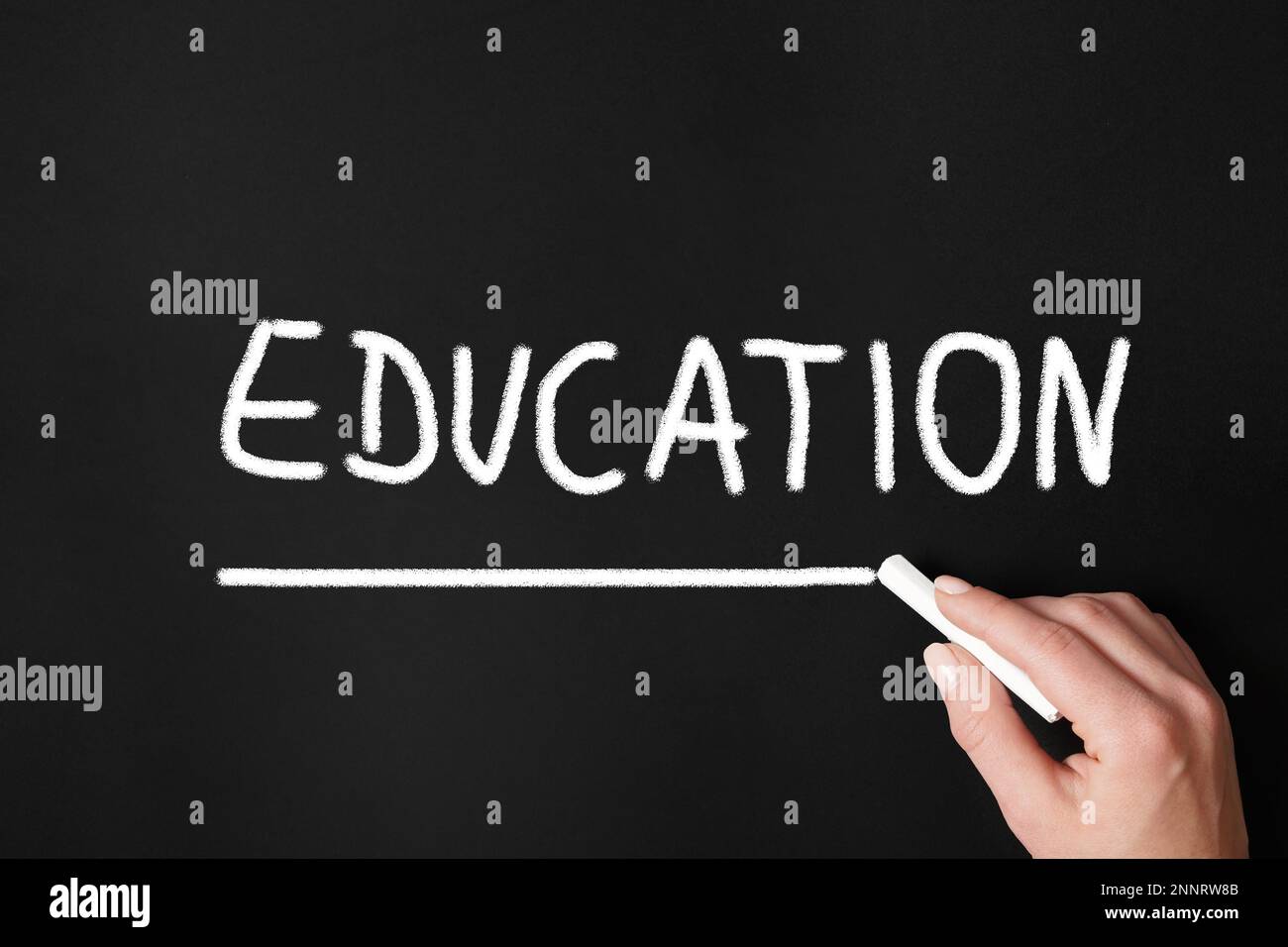 hand writing word education with chalk on chalkboard or blackboard ...
