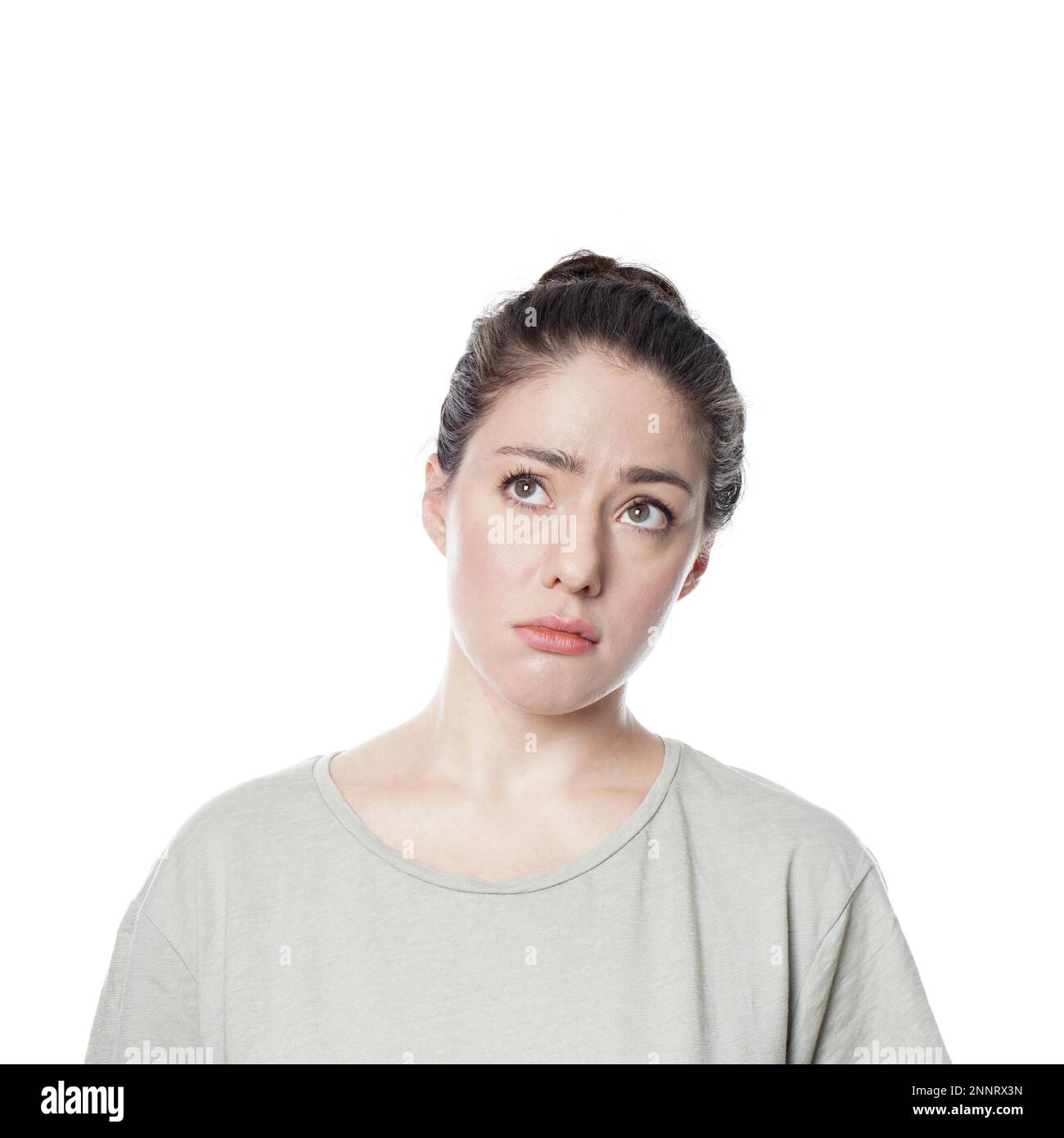 worried thoughtful young woman with concerned look on her face looking ...