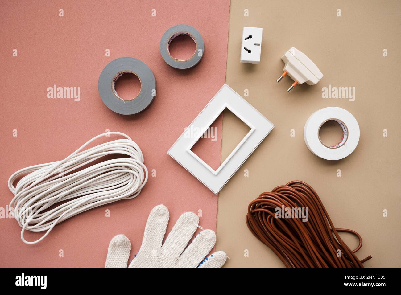 Wire plug button insulating tape glove dual background Stock Photo - Alamy