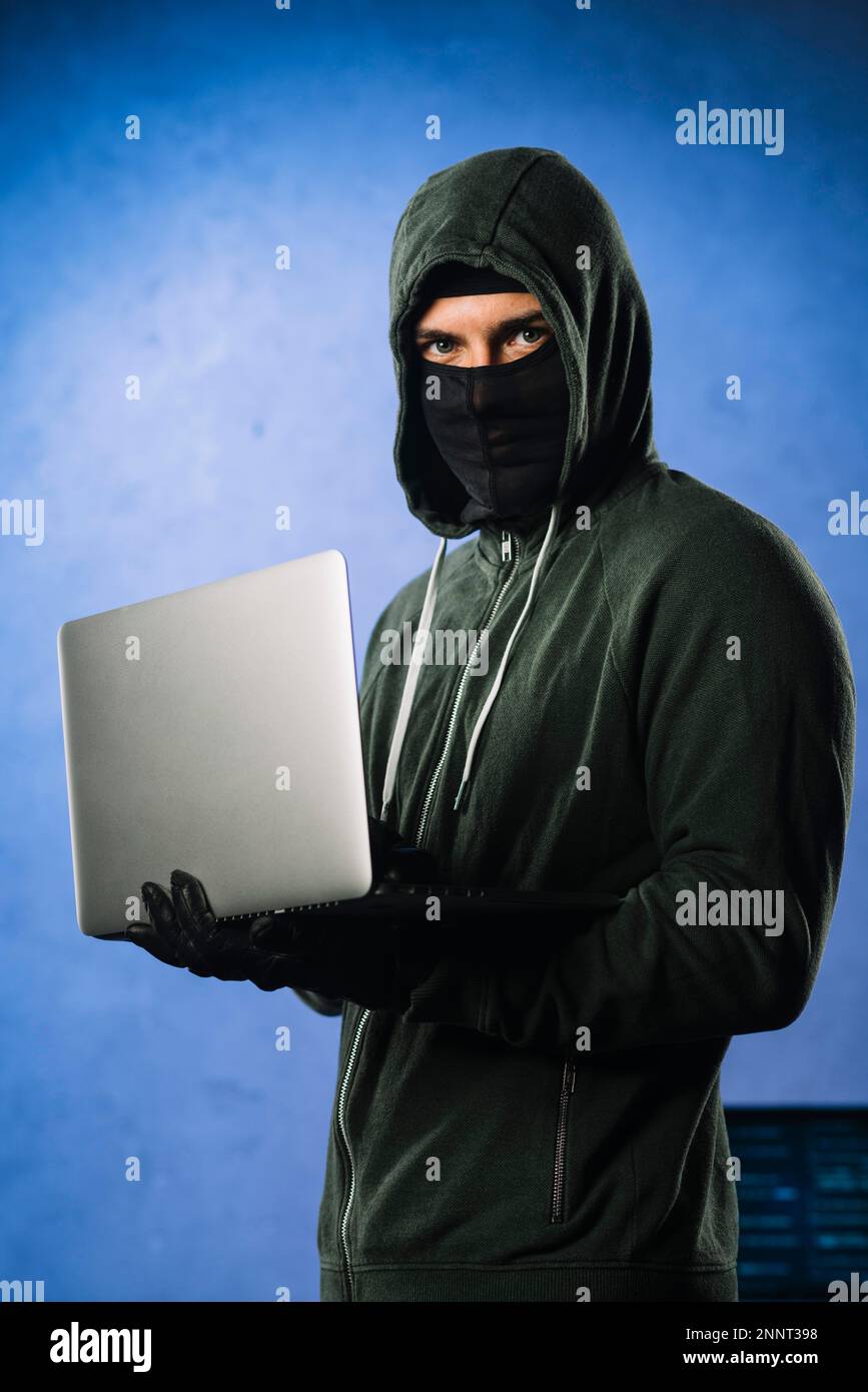 hacker with laptop Stock Photo - Alamy